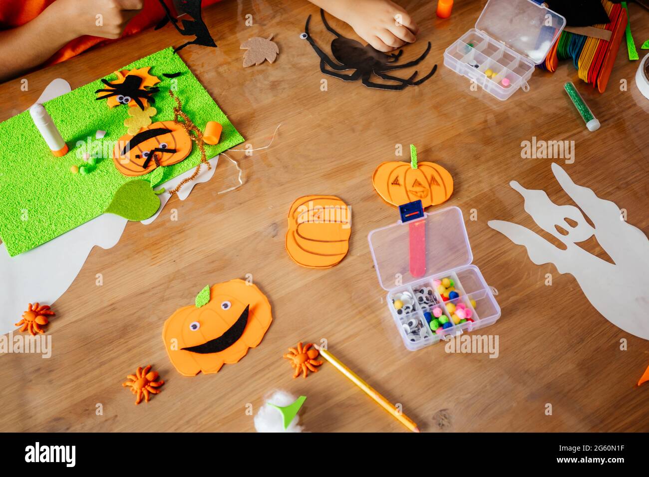 Funny Halloween pumpkins made of felt and paper, top view Stock Photo ...