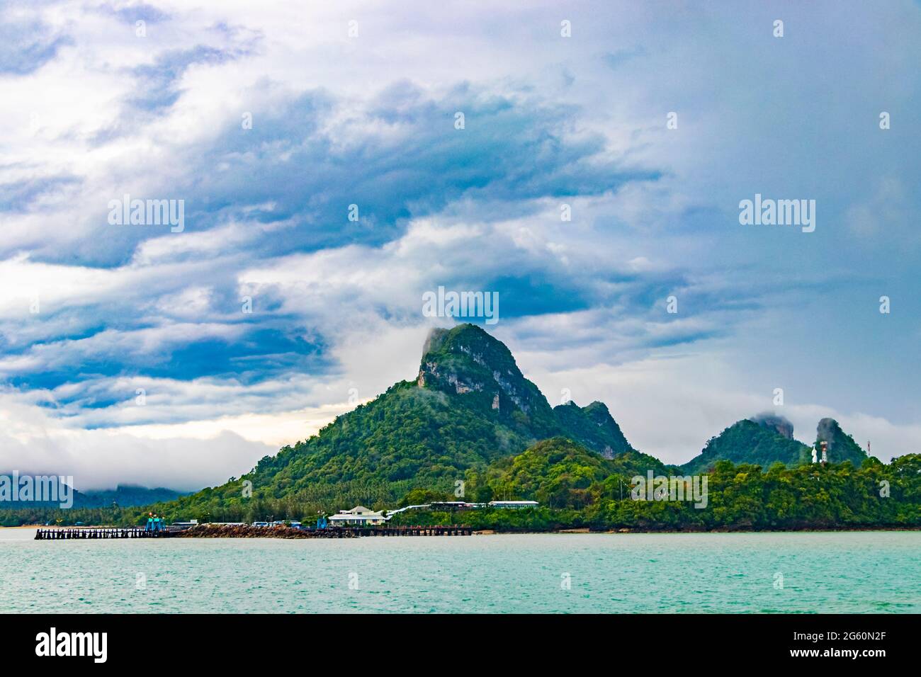 Travel to Don Sak over turquoise water in tropical landscape via ferry ...