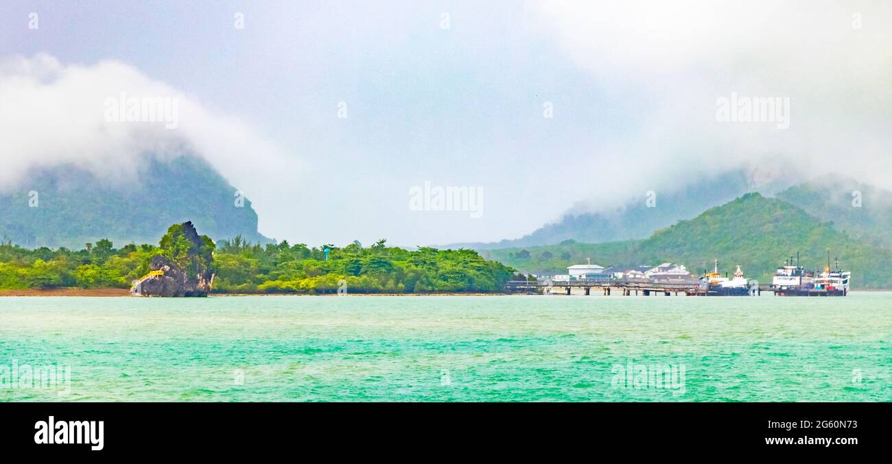 Travel to Don Sak over turquoise water in tropical landscape via ferry ...