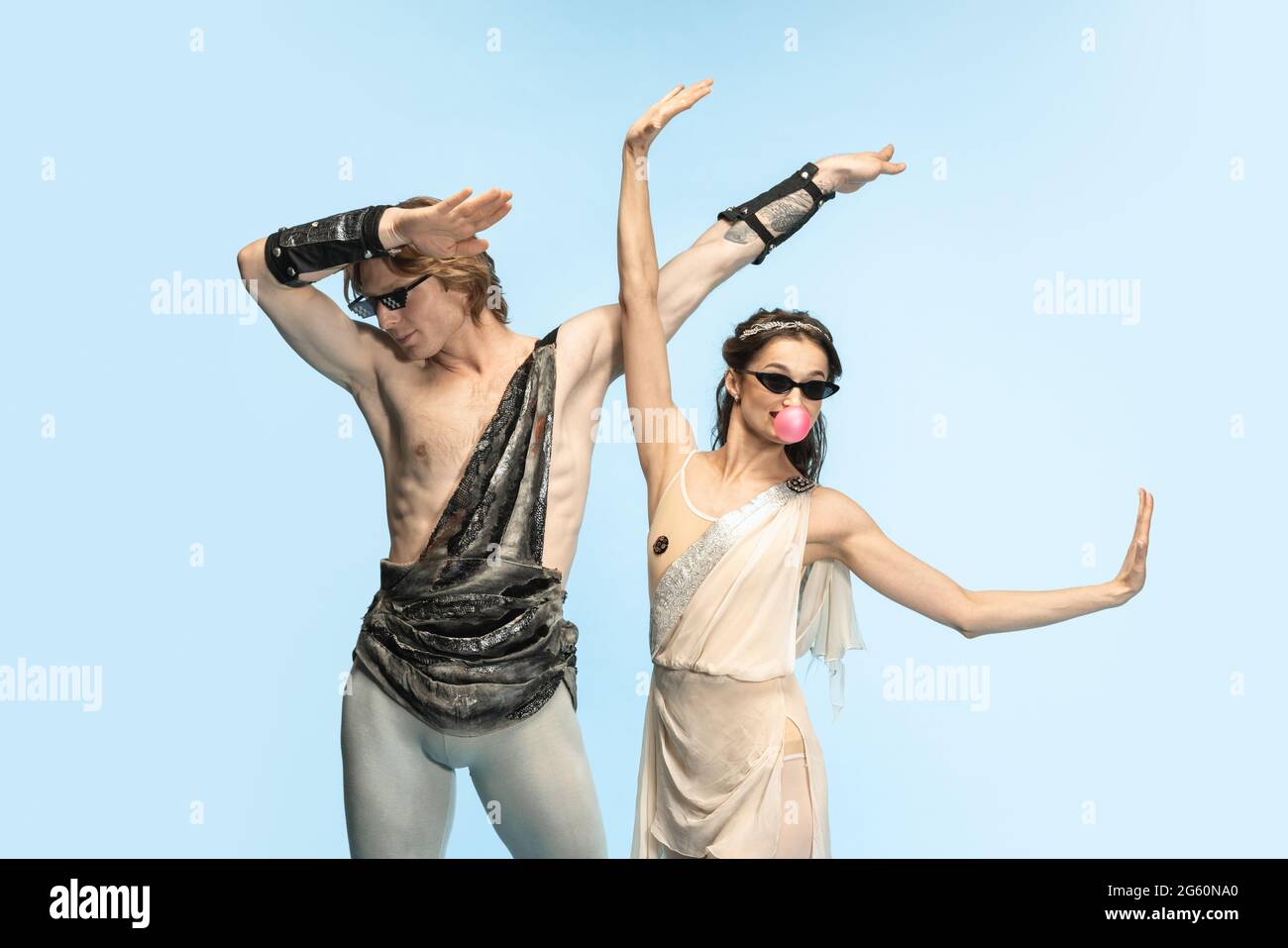 Bubbles gum. Young couple of ballet dancers in ancient Rome costums at ...
