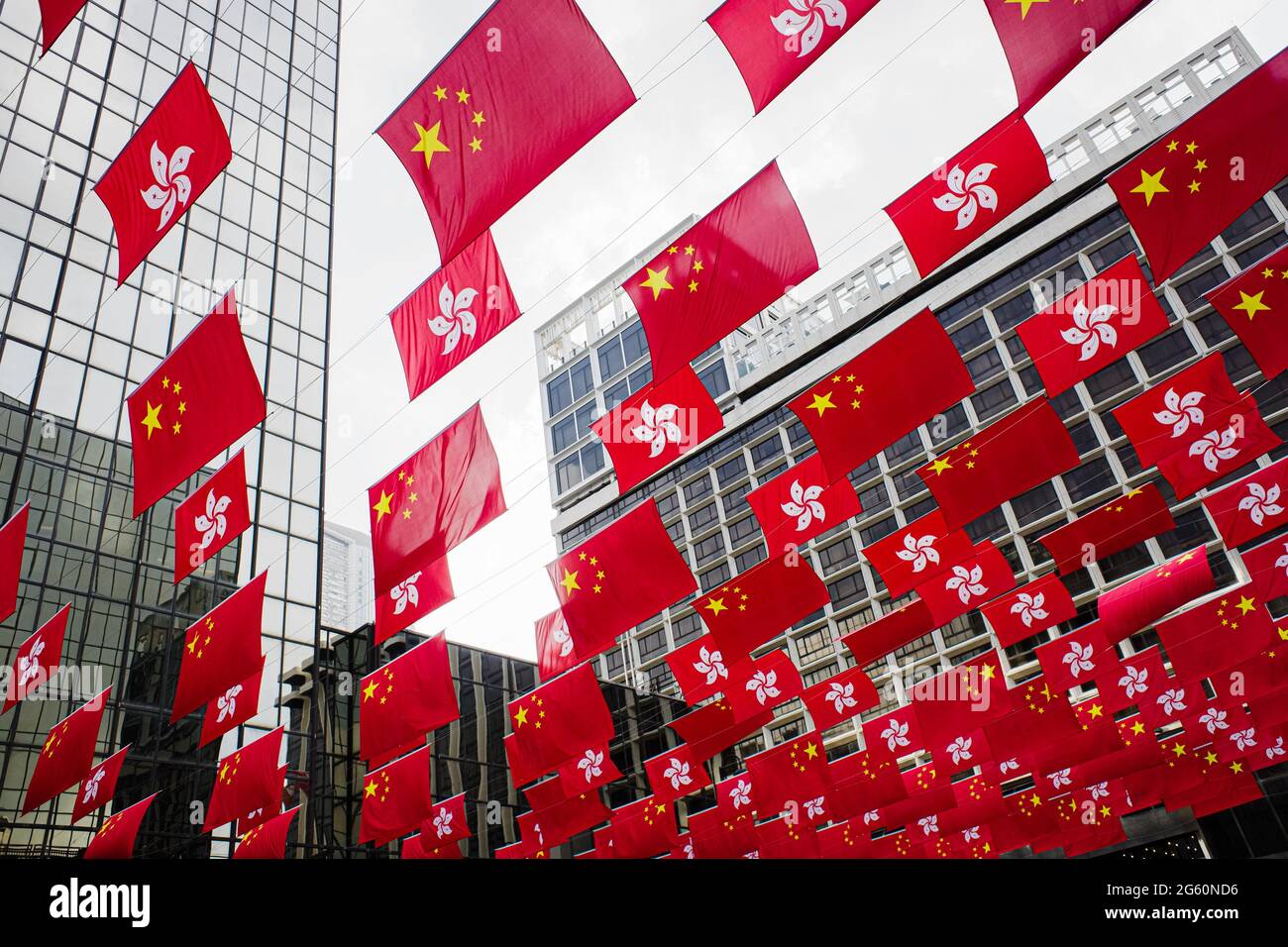 Hong Kong, China. 1st July, 2021. China and Hong Kong SAR flags are ...