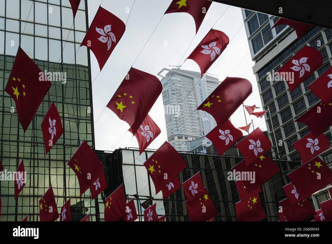 Hong Kong, China. 1st July, 2021. China and Hong Kong SAR flags are ...