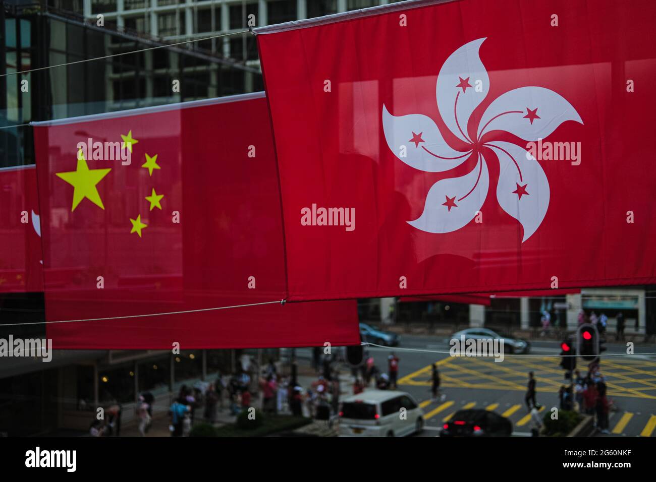Hong Kong, China. 1st July, 2021. China and Hong Kong SAR flags are ...