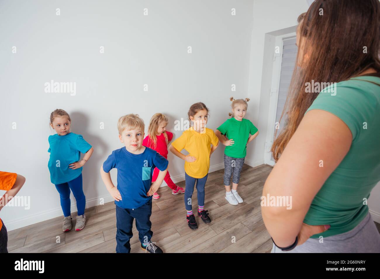 Active and motivated kids doing sport exercises at kindergarten Stock ...