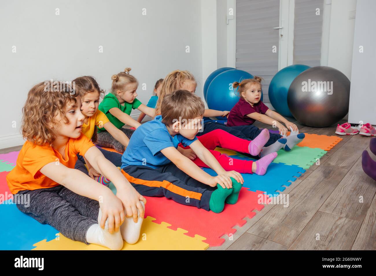 Children exercising while physical education lesson at preschool Stock ...