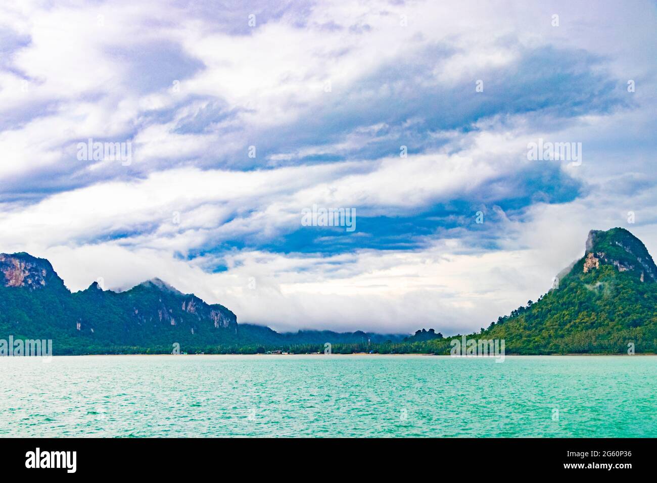 Travel to Don Sak over turquoise water in tropical landscape via ferry ...