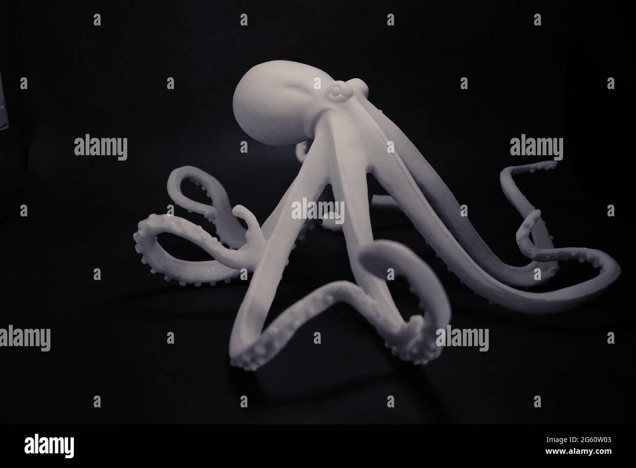 Stone octopus with dark background in bold, bright colors Stock Photo ...