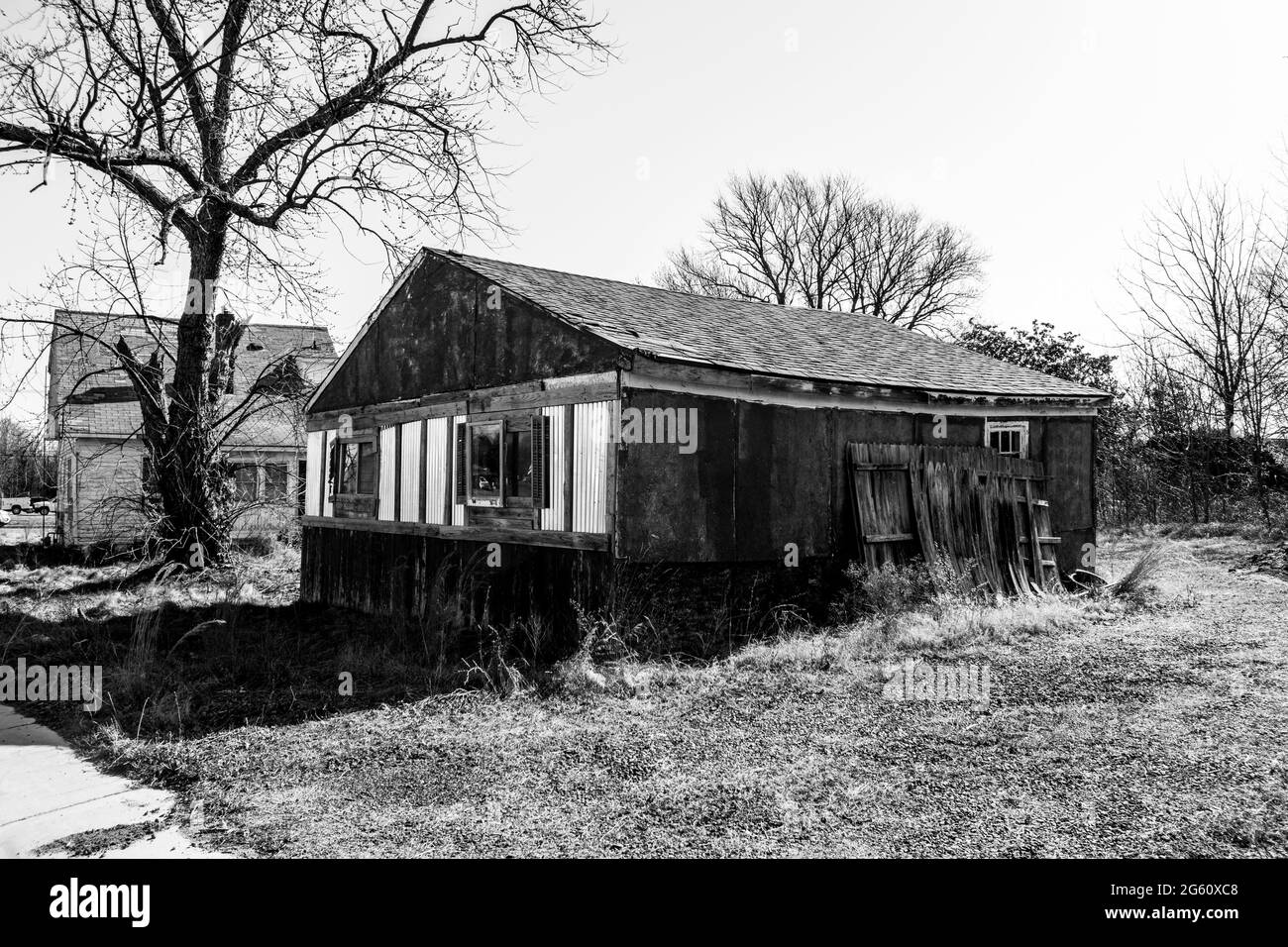 Side view of old barn, outdoor building, in black and white with a ...