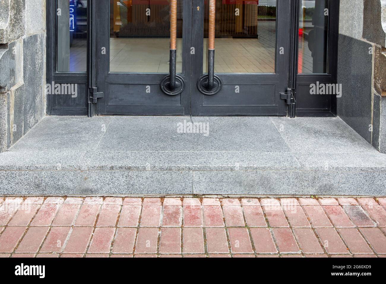 a threshold with a step at the threshold entrance to the store with a ...
