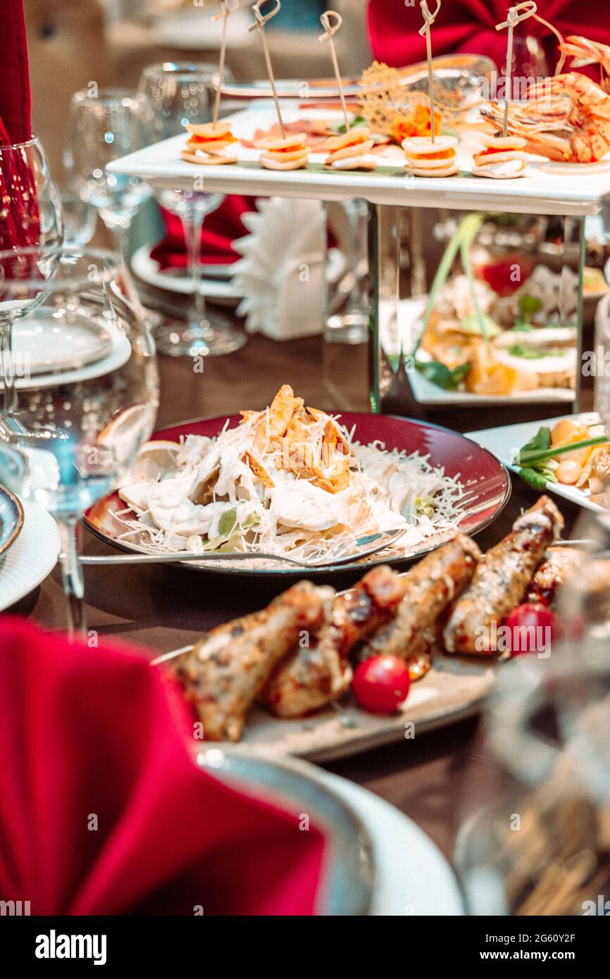 Caesar salad on the festive table in the cafe Stock Photo - Alamy