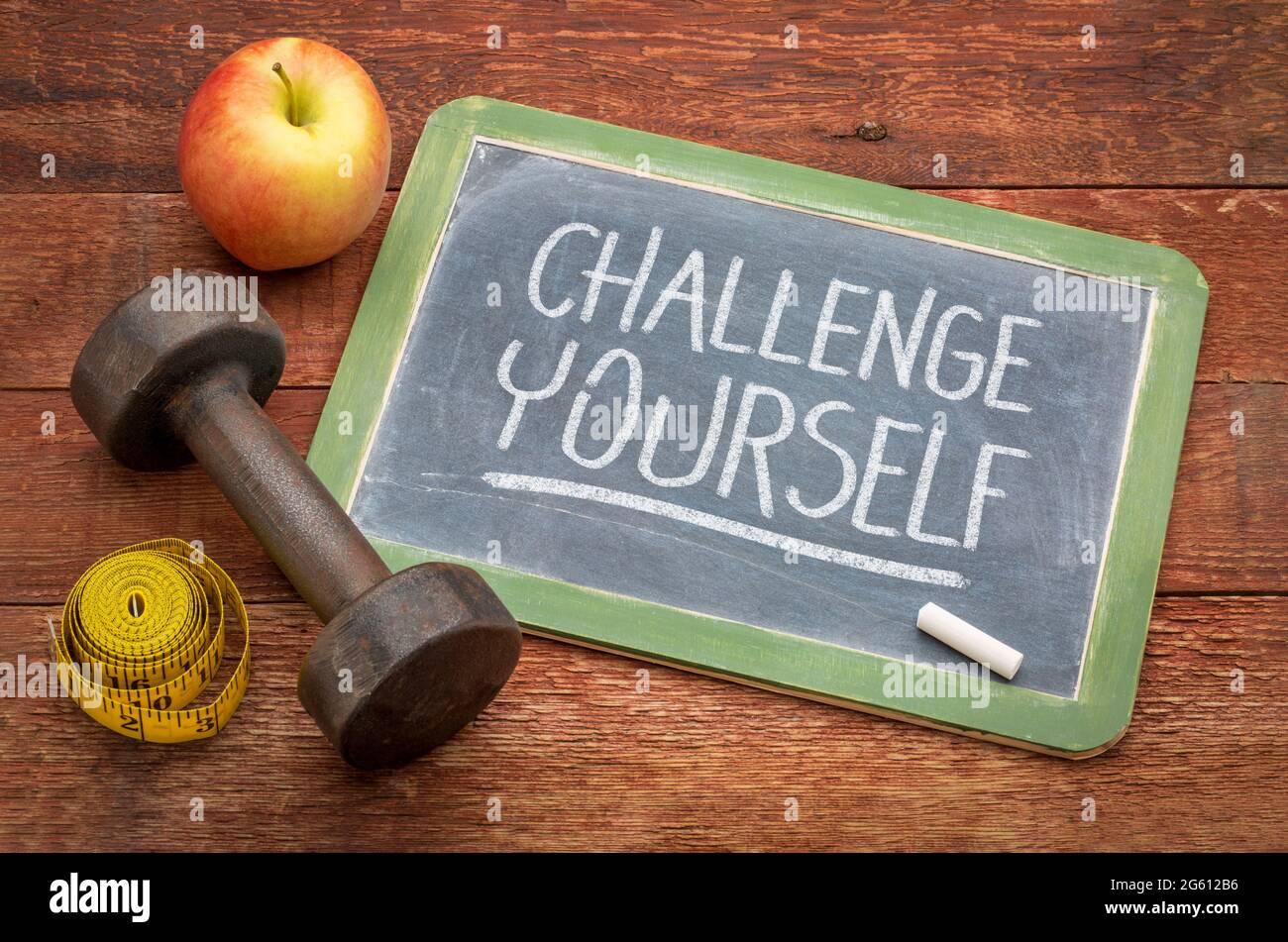 challenge yourself motivational concept, white chalk writing on a slate ...