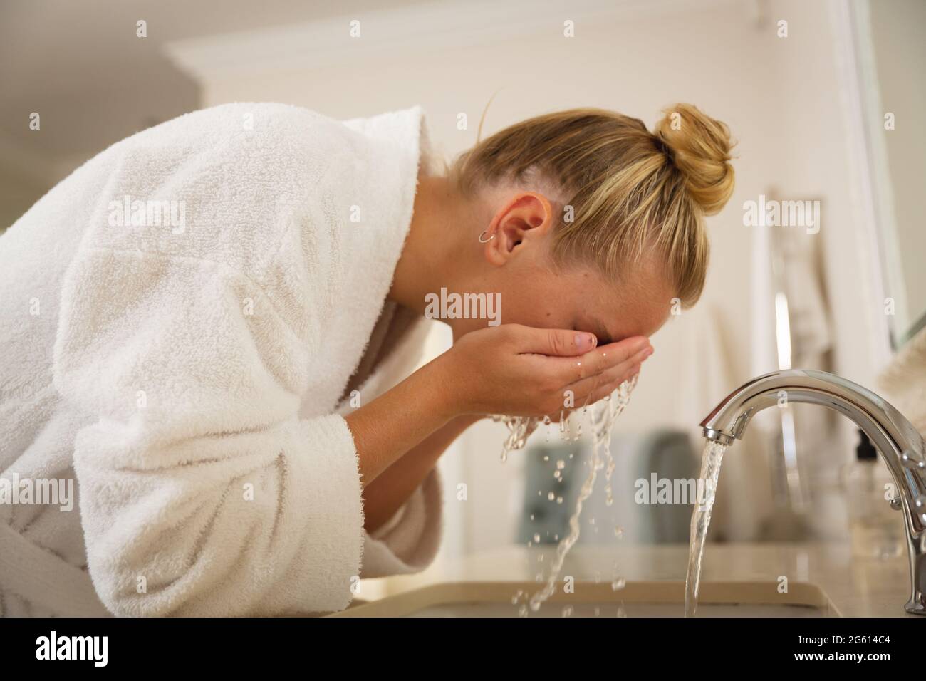 Beautiful woman washing face hi-res stock photography and images - Alamy