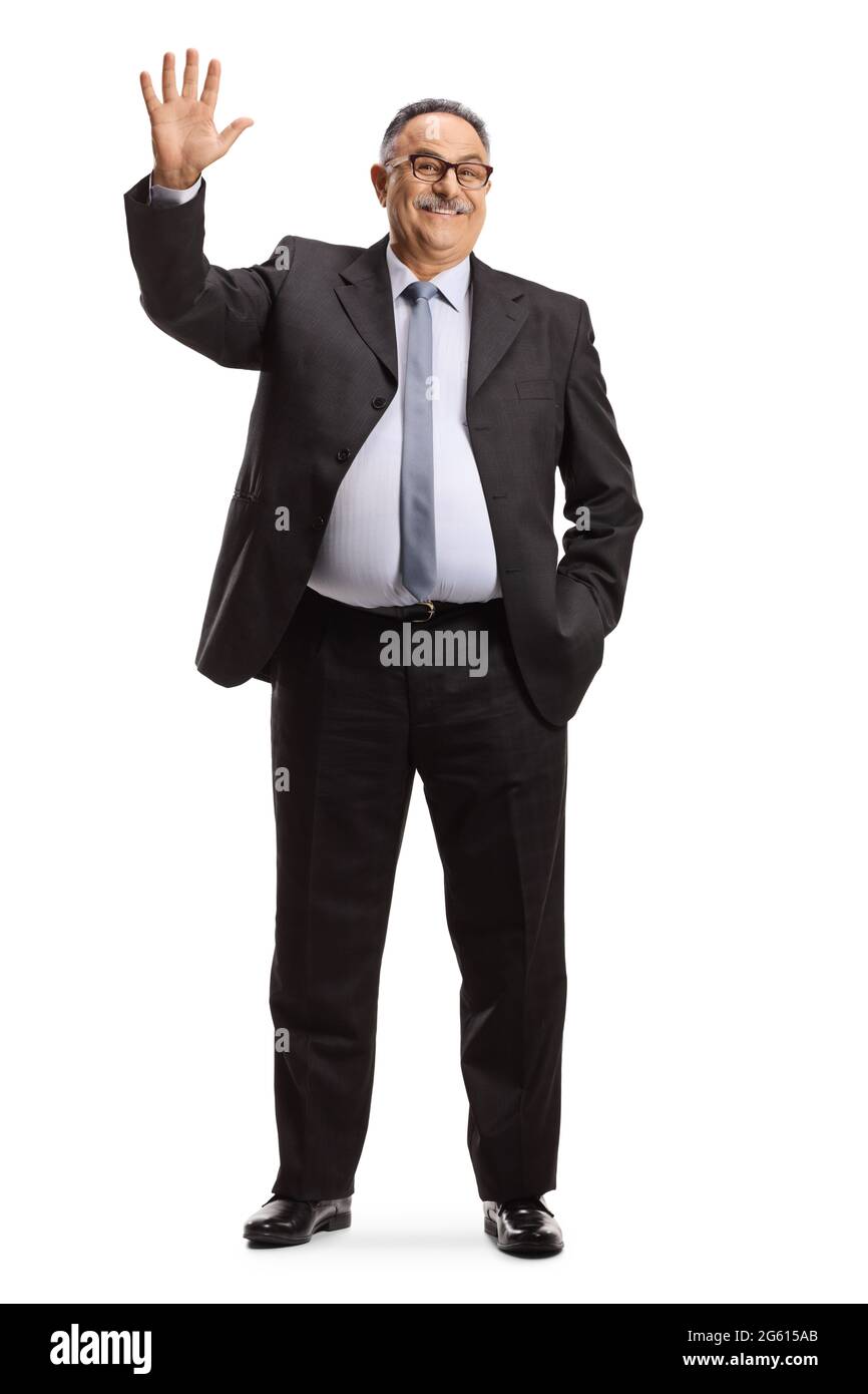 Full length portrait of a mature businessman waving hello isolated on ...