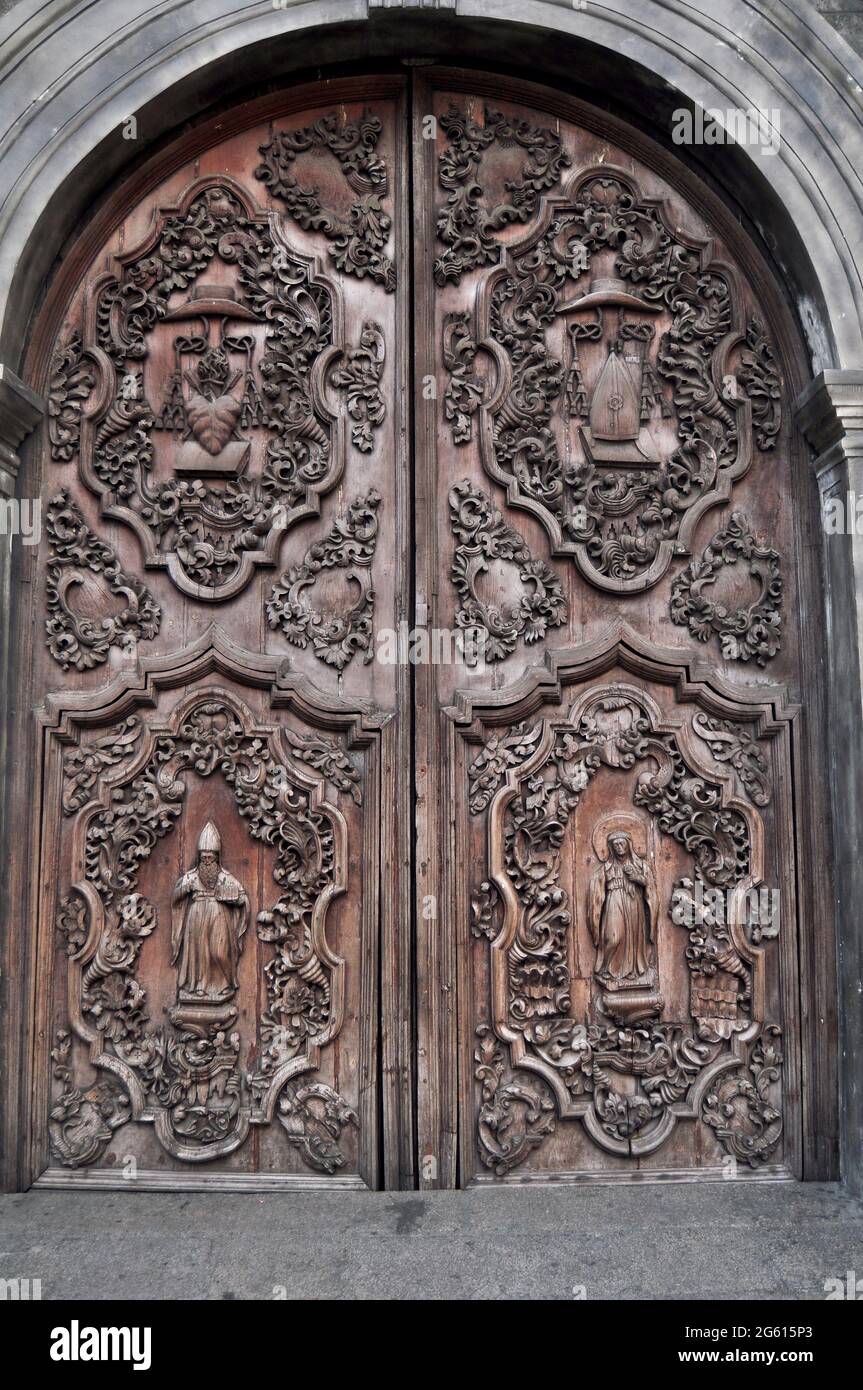 Antique carving wooden door window of Convento de san agustin church or ...