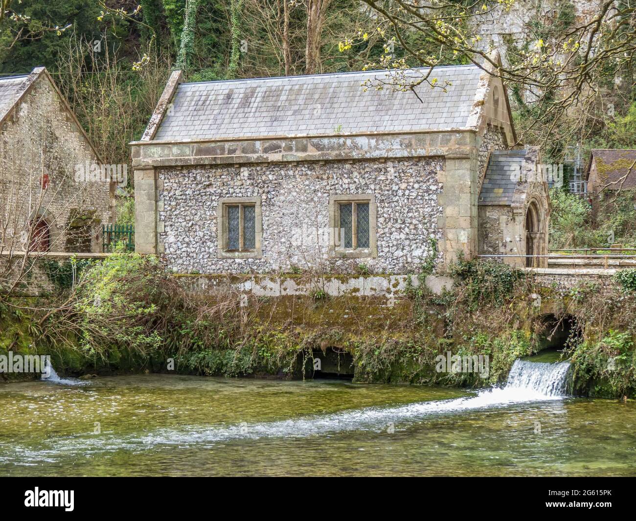 pretty old stone building by the river Stock Photo - Alamy