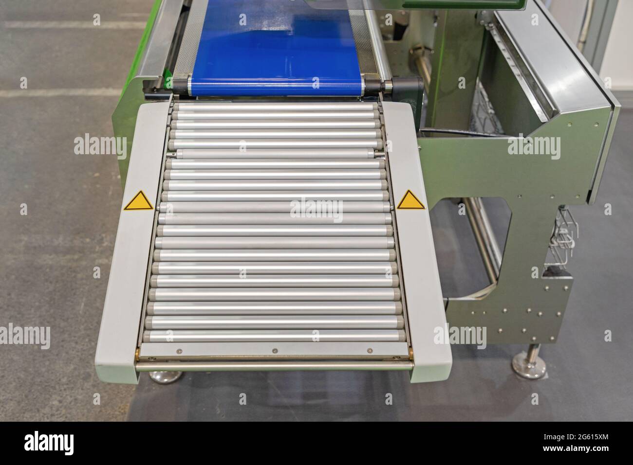 Conveyor Rollers at Machine Production Line in Factory Stock Photo - Alamy