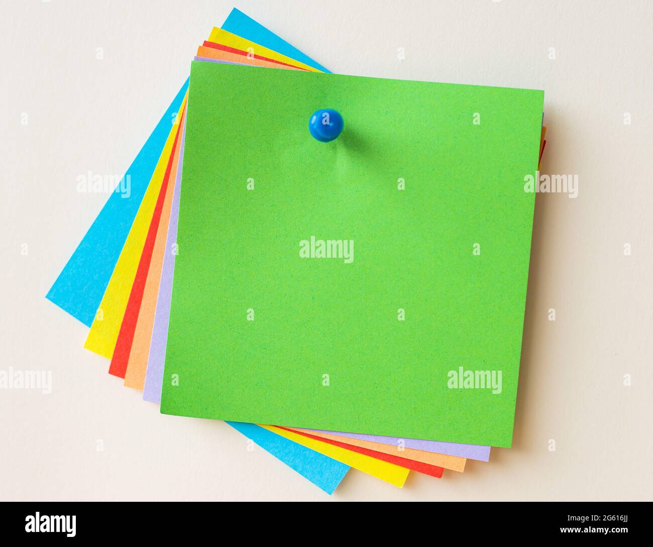 Colorful Paper Notes Stacked Together And Pinned On The Wall. Different ...