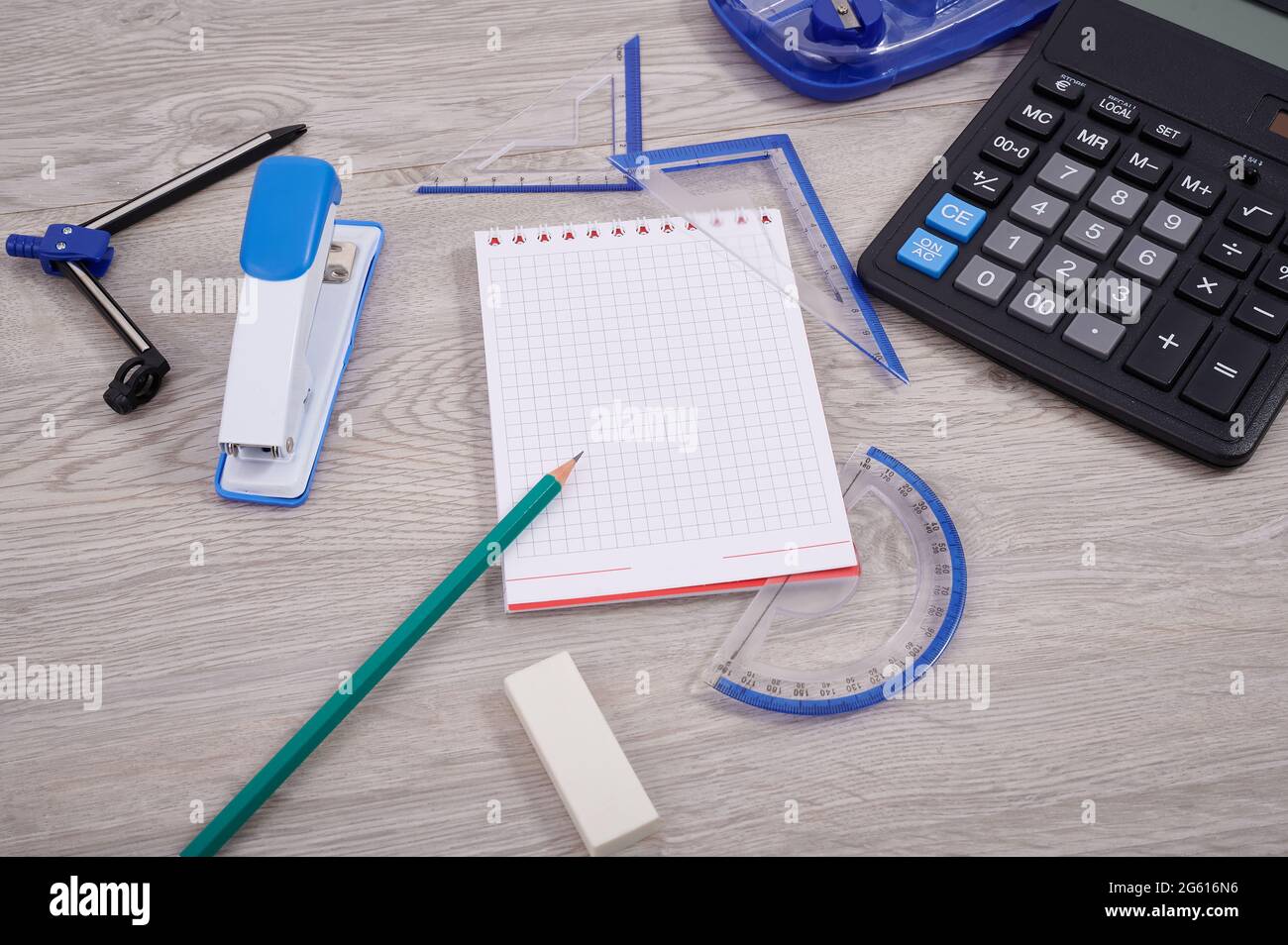 Blank Notebook Page With A Calculator And Geometric Stationery Sets On ...