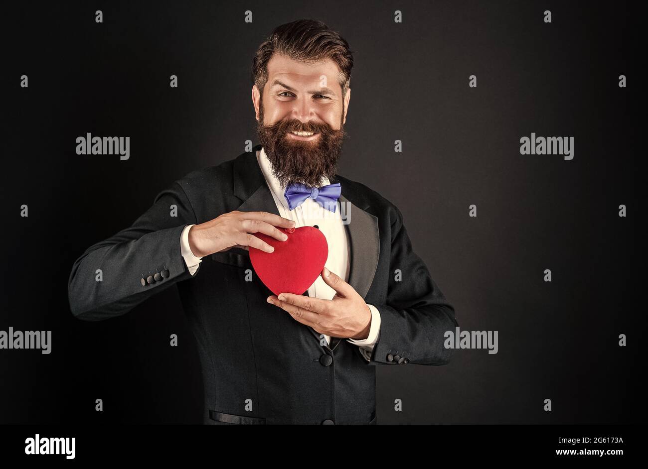 In love. happy handsome man making proposal. romantic gift. tuxedo man ...