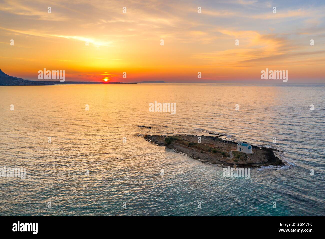 An old white church in a small island at sunset in Malia, Crete, Greece ...