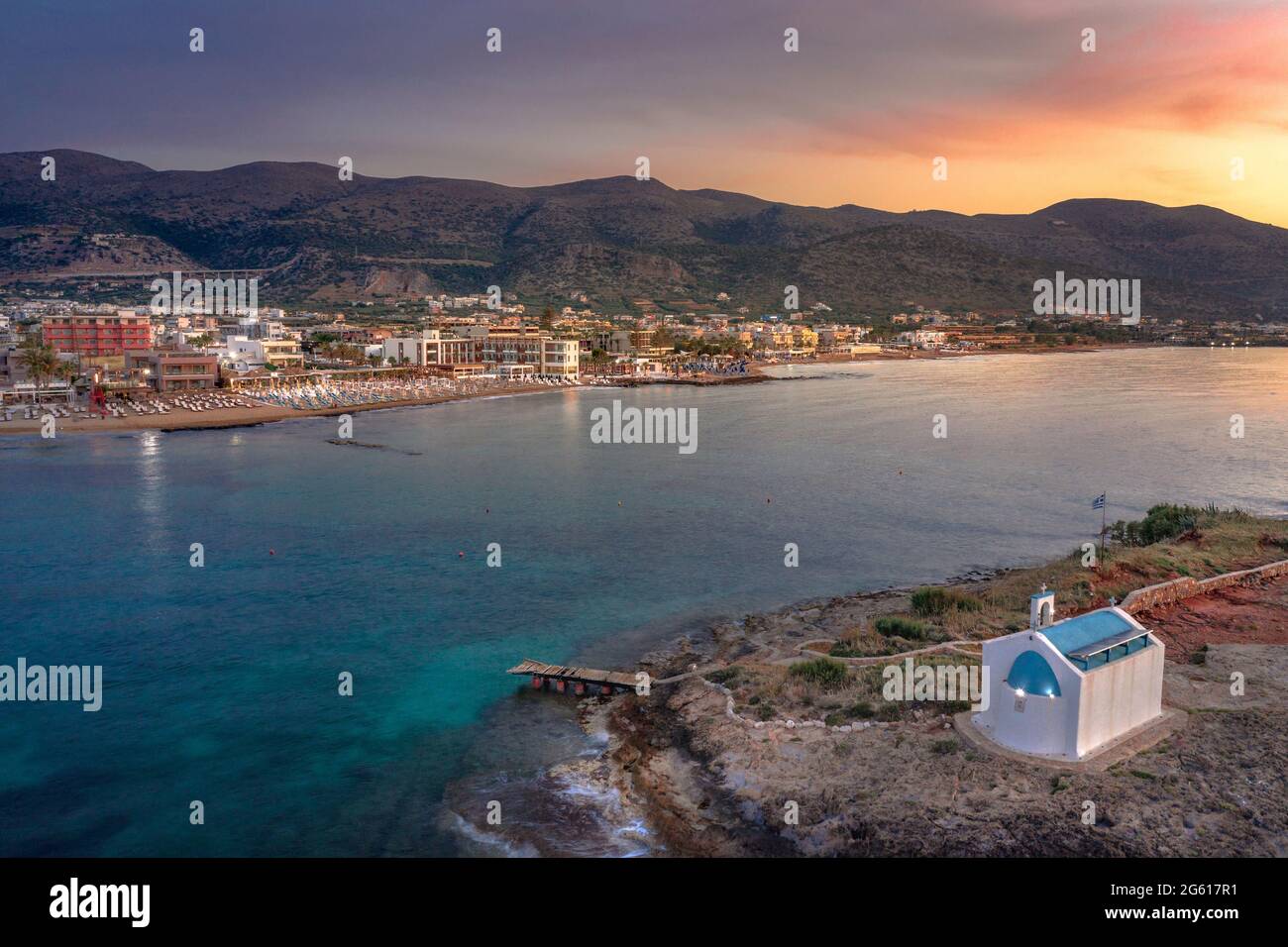 An old white church in a small island at sunset in Malia, Crete, Greece ...