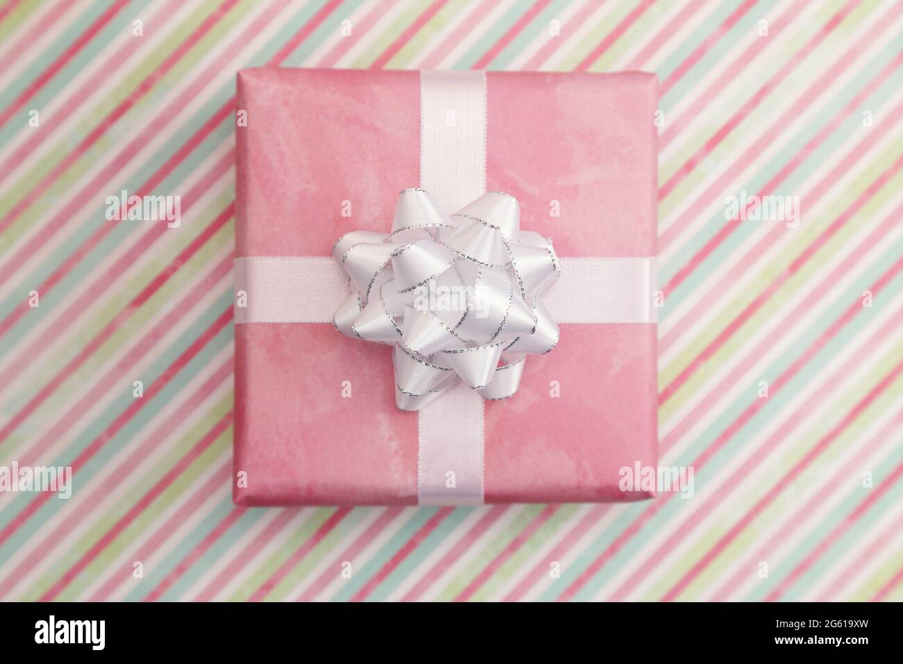 A Single Simple Wrapped Present on a Matching Background Stock Photo ...