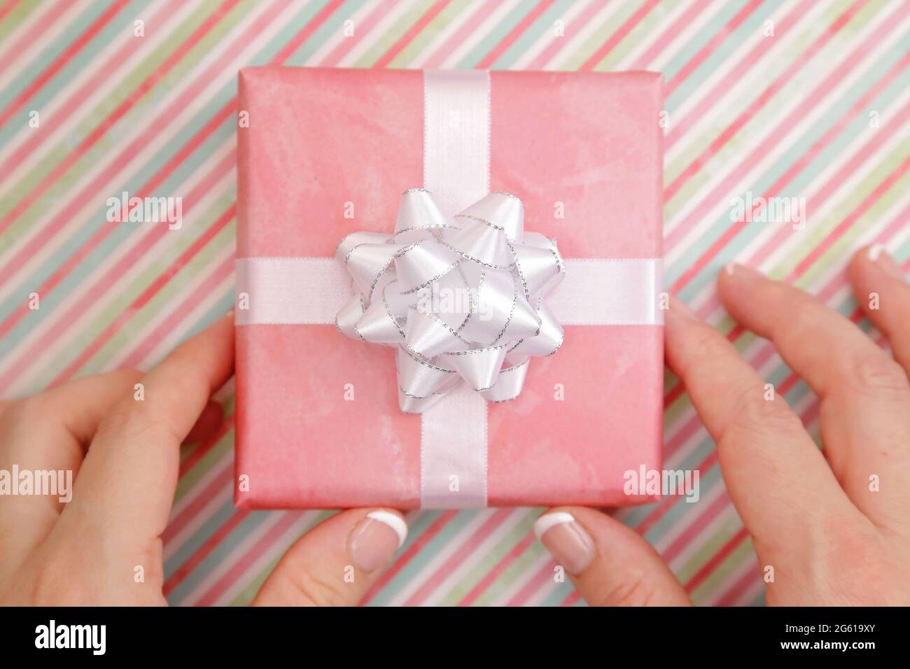 A Single Simple Wrapped Present on a Matching Background Stock Photo ...