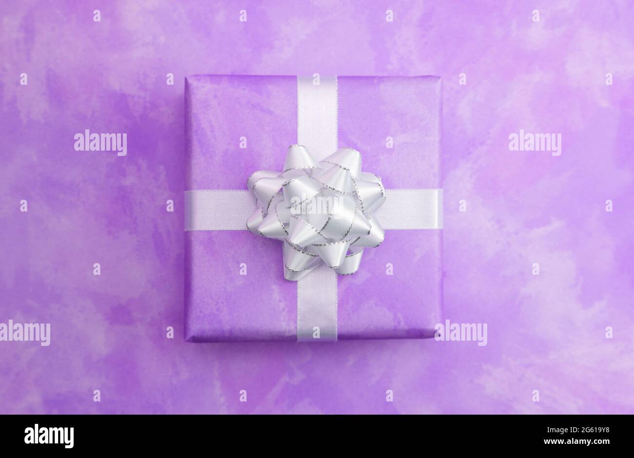 A Single Simple Wrapped Present on a Matching Background Stock Photo ...
