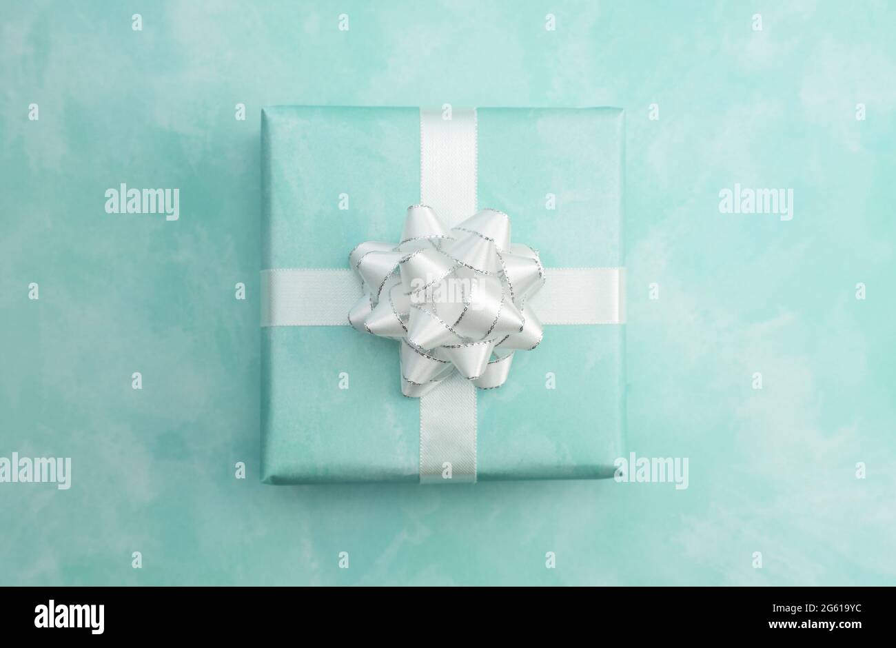 A Single Simple Wrapped Present on a Matching Background Stock Photo ...