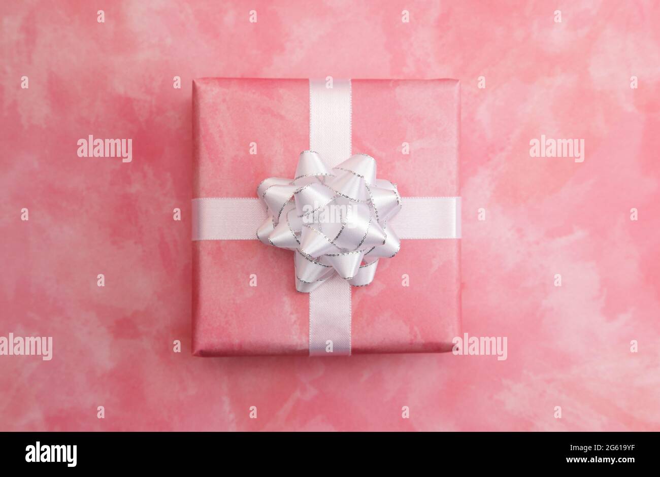 A Single Simple Wrapped Present on a Matching Background Stock Photo ...