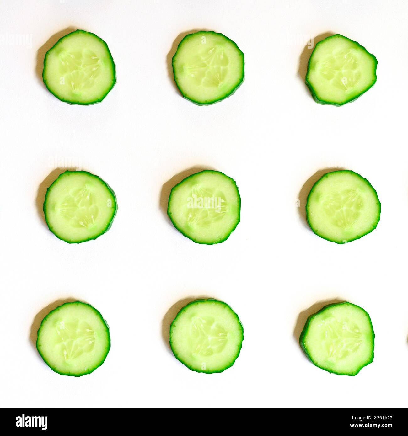repeating pattern of sliced semicircles of fresh raw vegetable ...