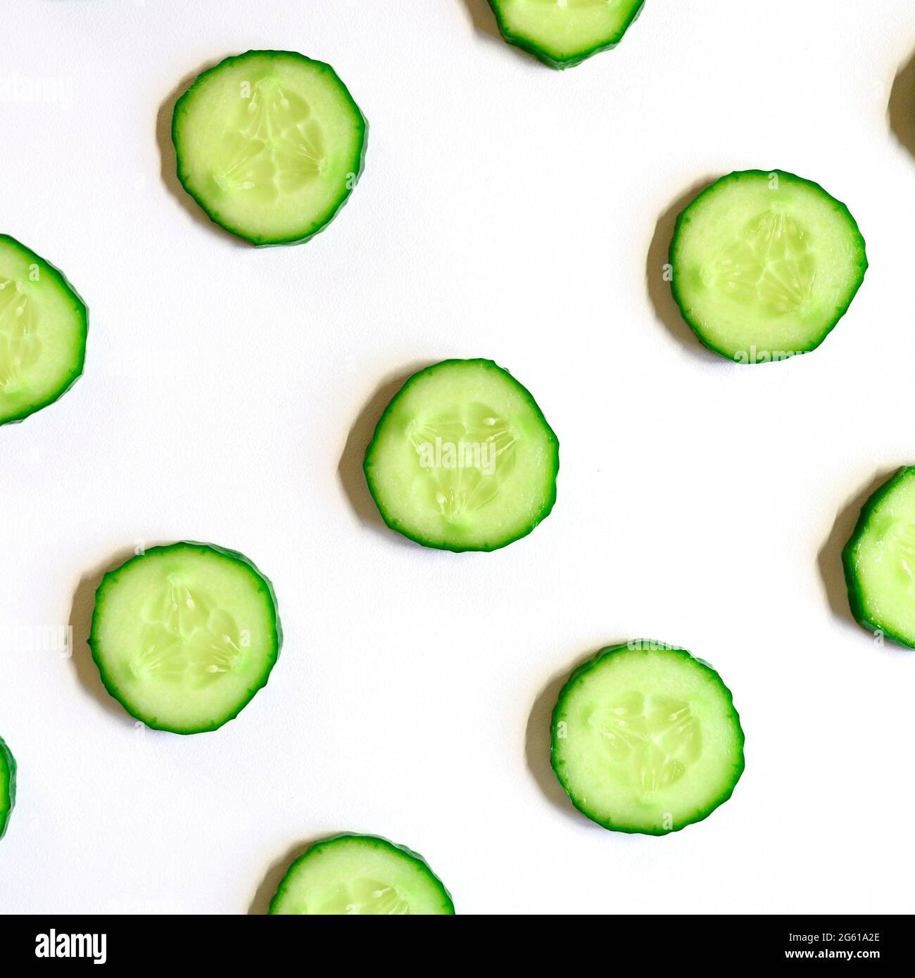 repeating pattern of sliced semicircles of fresh raw vegetable ...