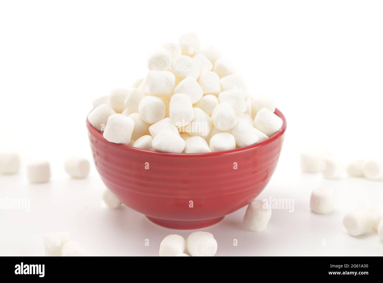 A Bowl Full of Mini White Marshmallows on a White Background Stock ...