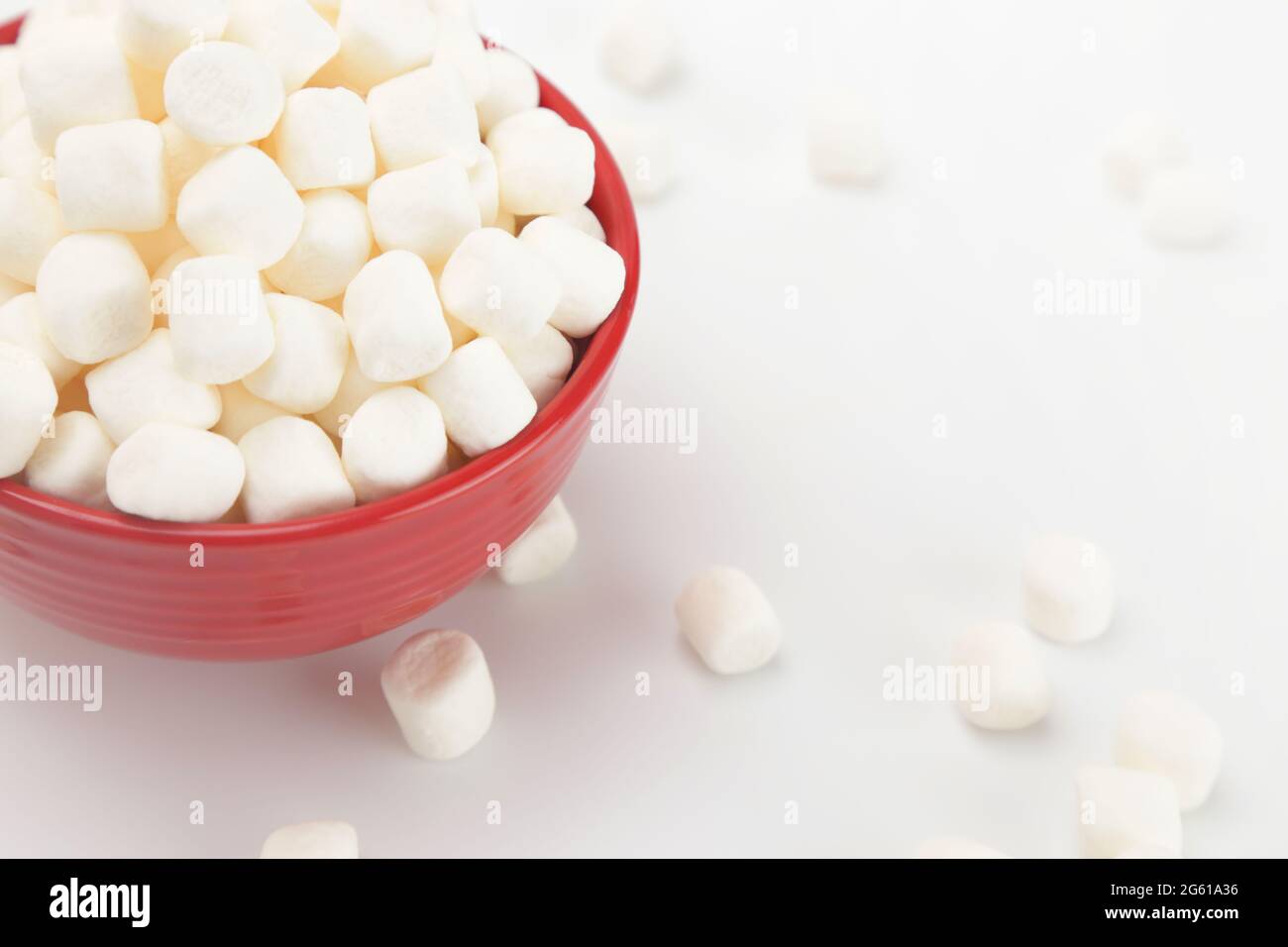 A Bowl Full of Mini White Marshmallows on a White Background Stock ...