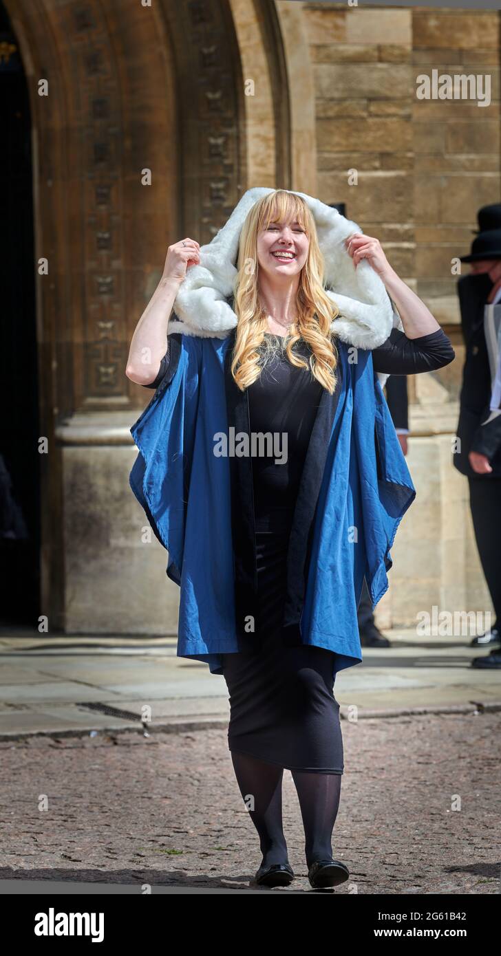 A female student poses for a photograph on her graduation day at ...