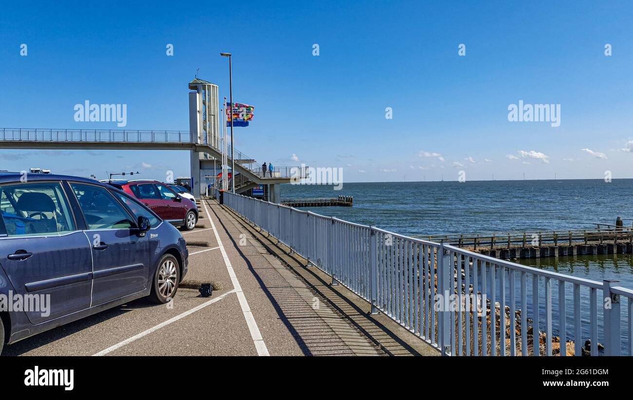 IJsselmeer in the Netherlands. April 17, 2021. Cars parked in ...