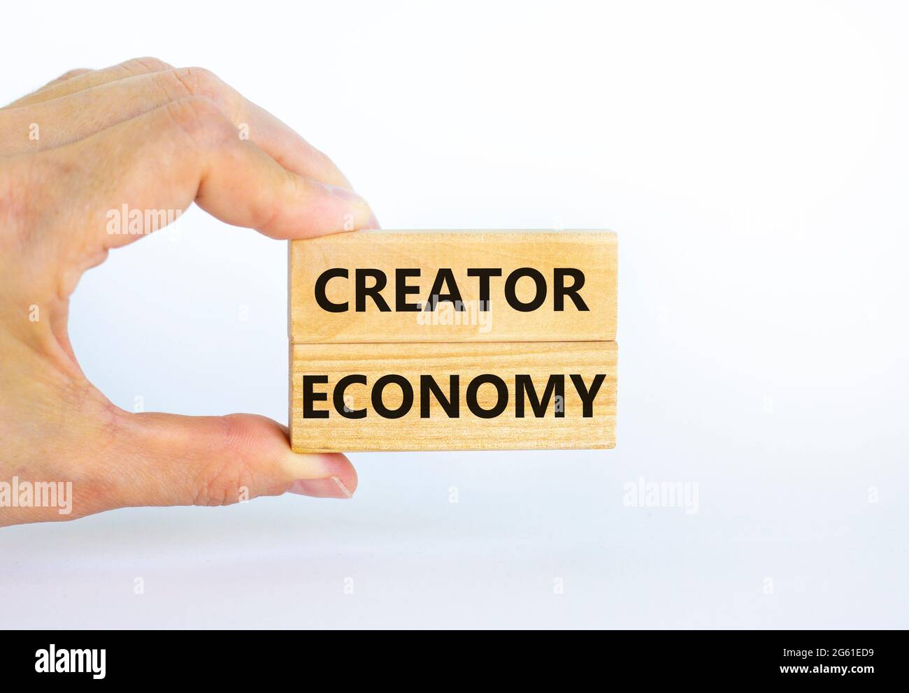 Creator economy symbol. Wooden blocks with words Creator economy on ...
