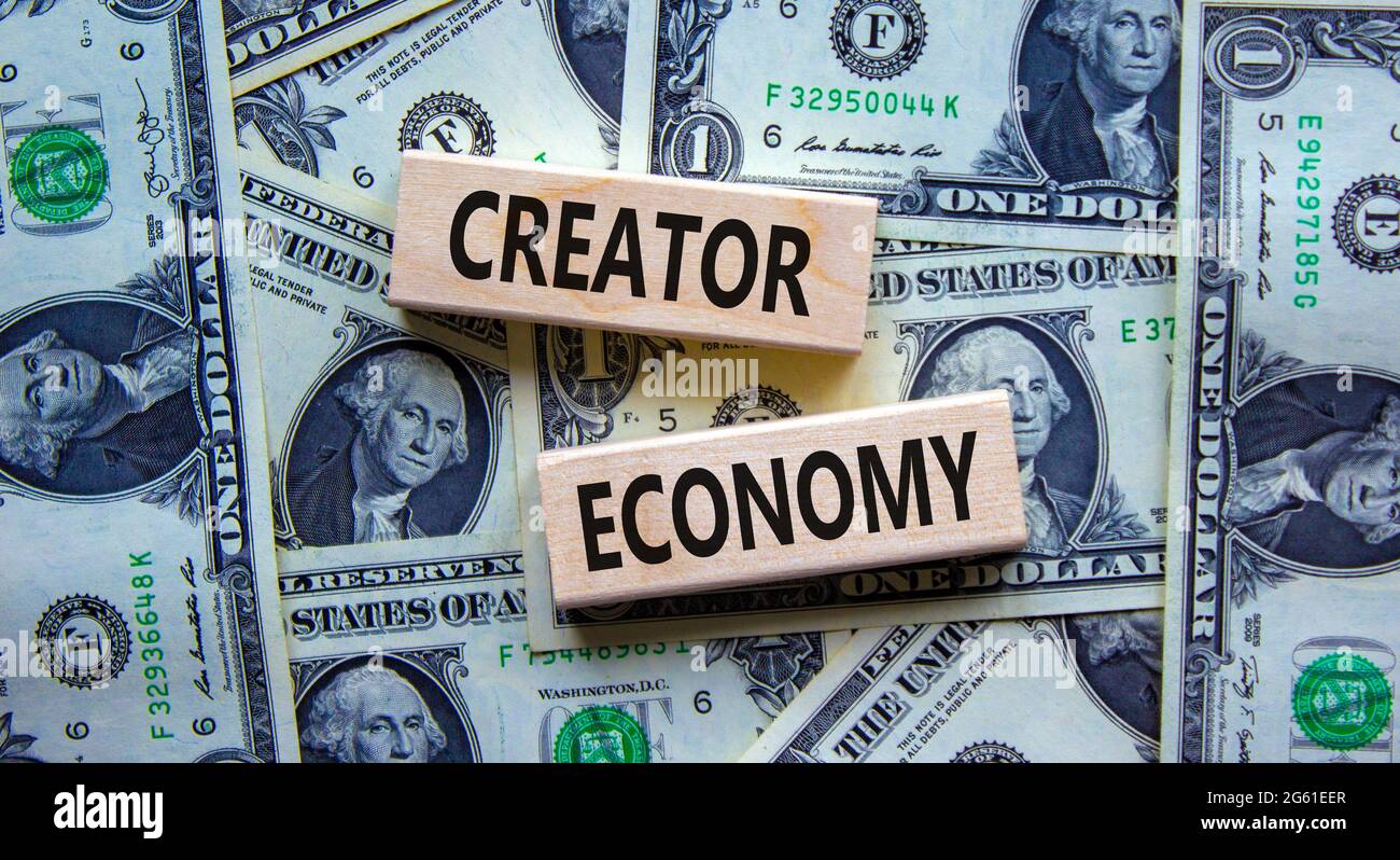 Creator economy symbol. Wooden blocks with words Creator economy on ...