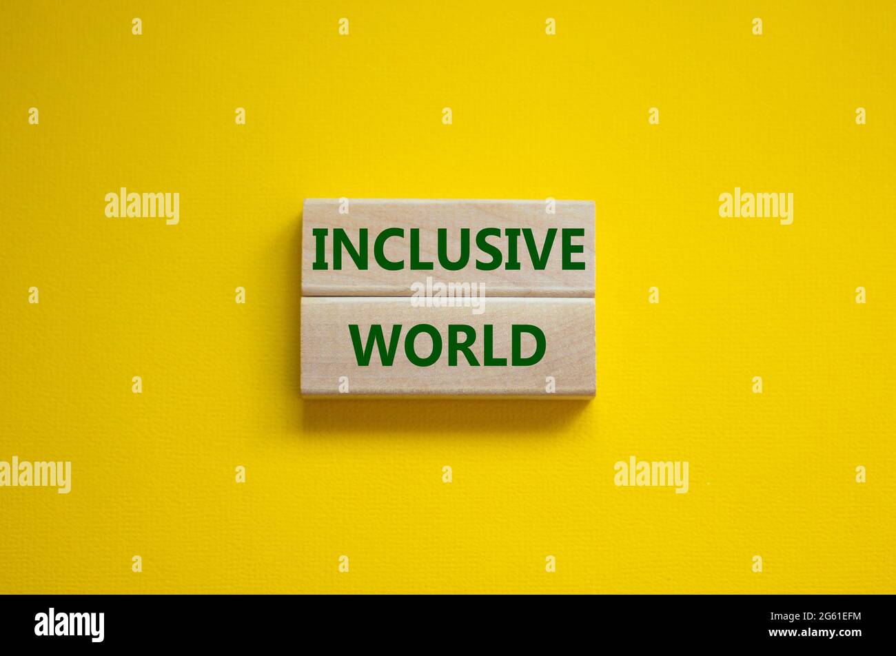 Inclusive world symbol. Wooden blocks with words Inclusive world on ...