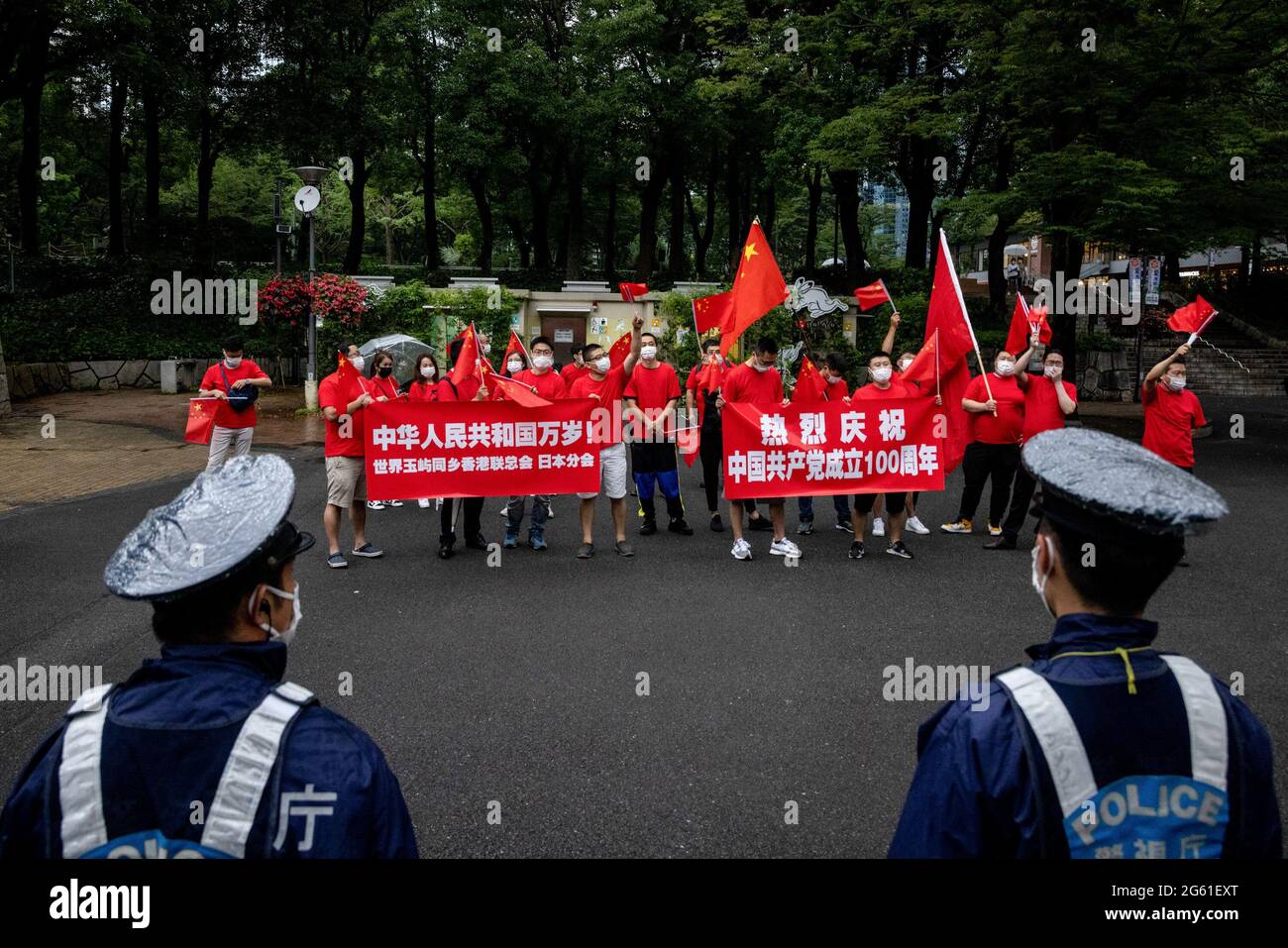 Tokyo, Japan. 01st July, 2021. Pro-Beijing supporters with Chinese ...