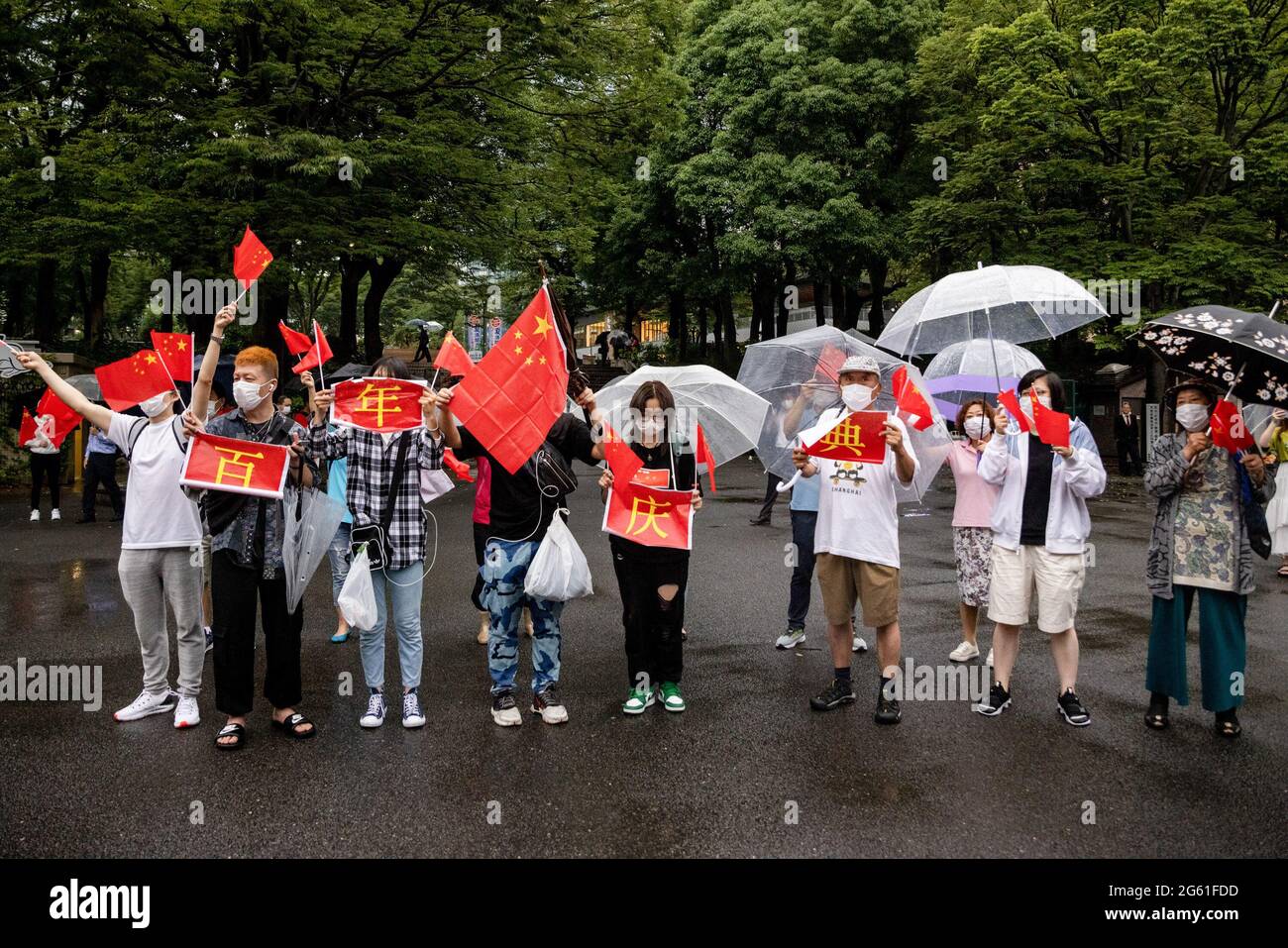 Pro-Beijing supporters with Chinese flags and placards seen during a ...
