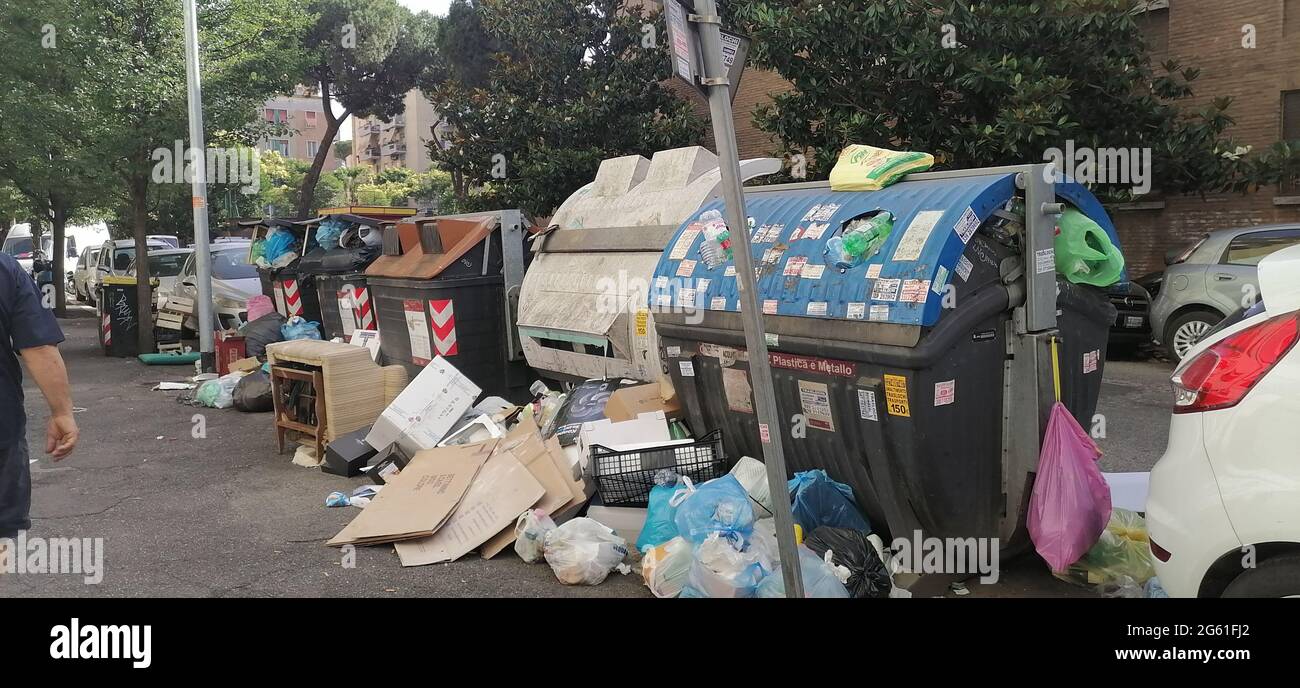 June 2021 - waste emergency in Rome, Italy. The bins full of garbage ...