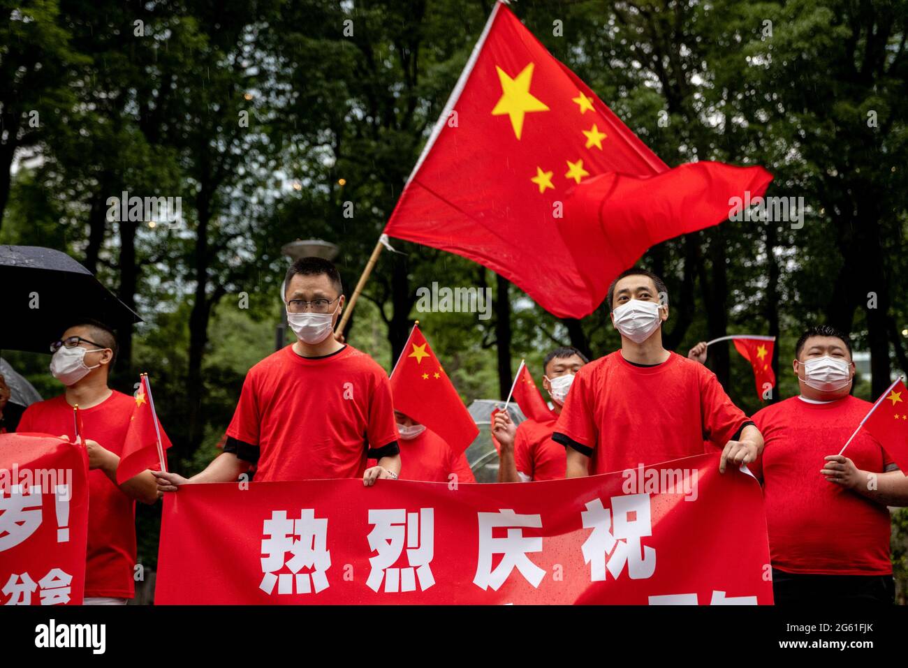 Pro-Beijing supporters with Chinese flags and banners seen during a pro ...