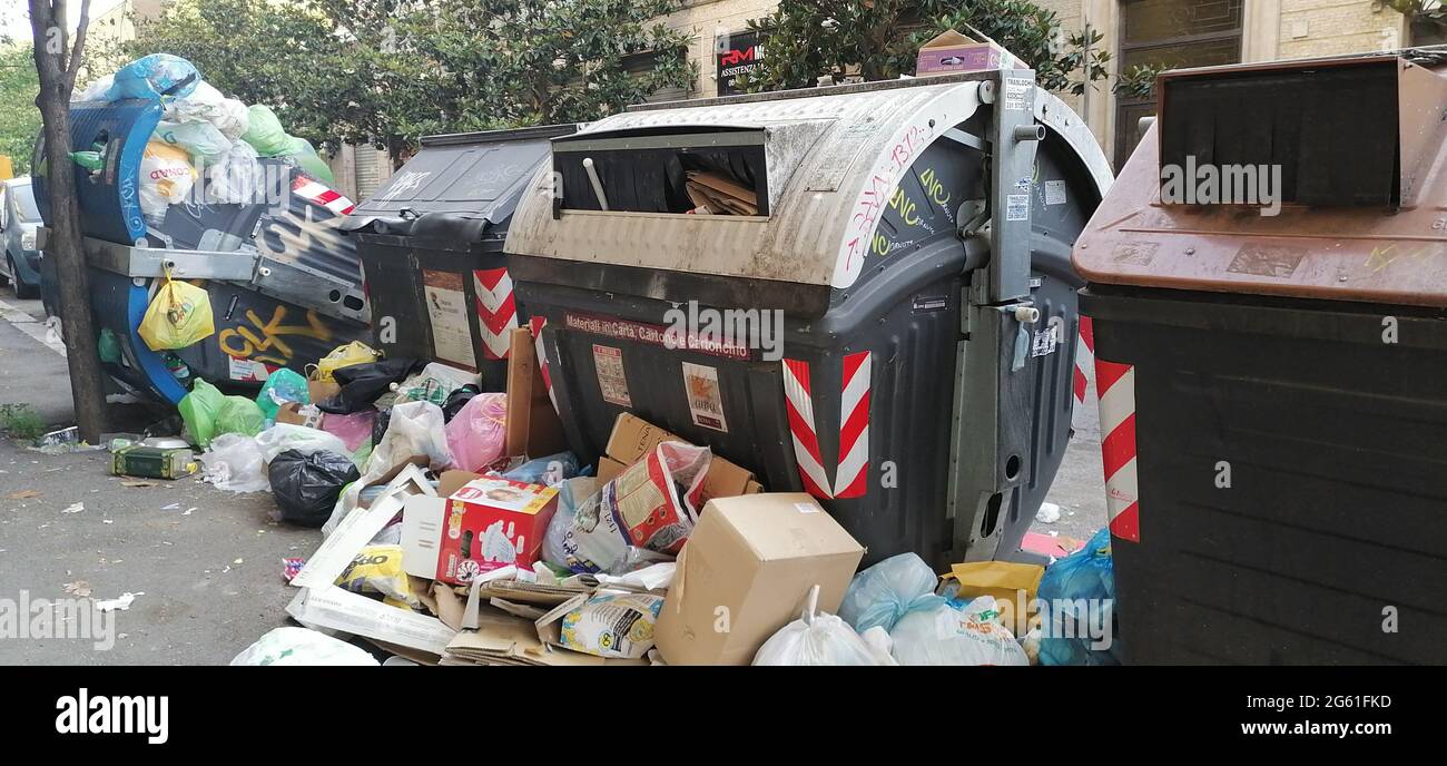 June 2021 - waste emergency in Rome, Italy. The bins full of garbage ...