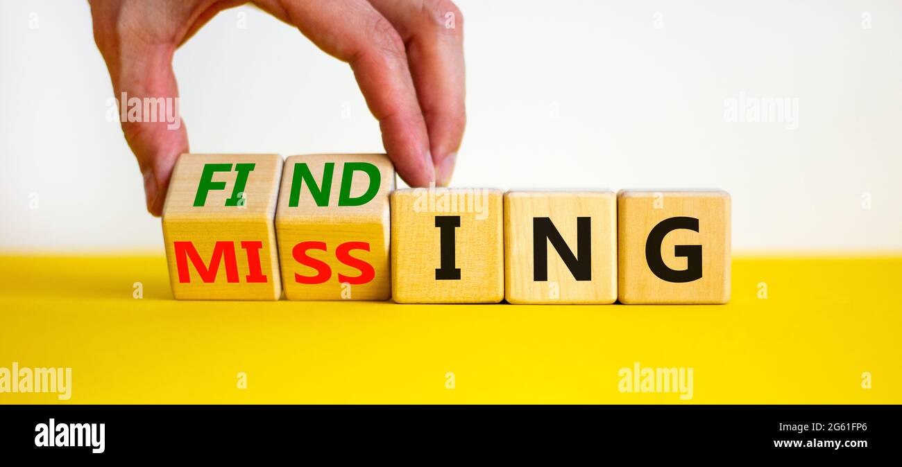 Finding or missing symbol. Businessman turns wooden cubes and changes ...