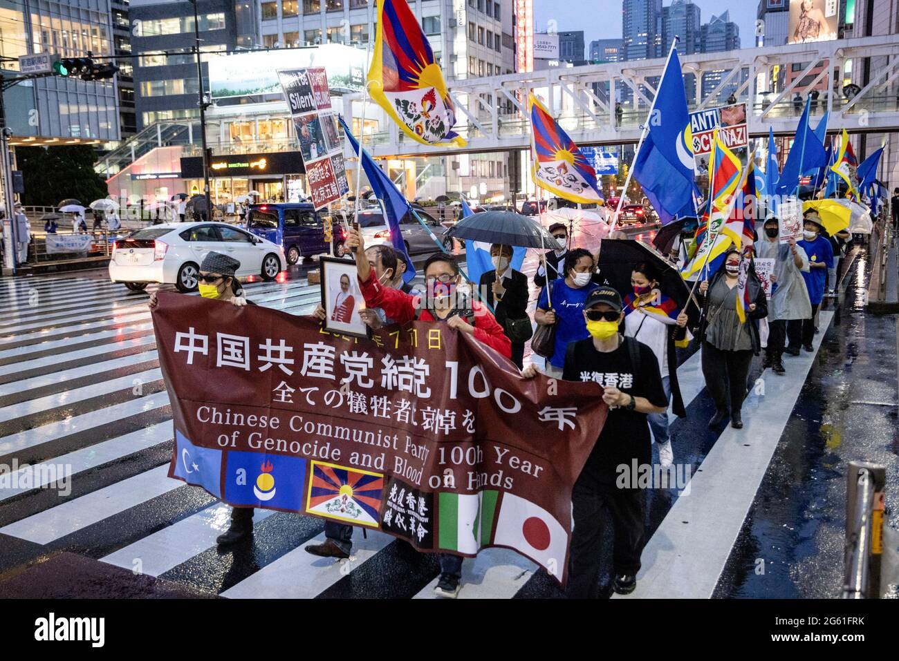 Protesters marching with a huge banner expressing their opinion, during ...