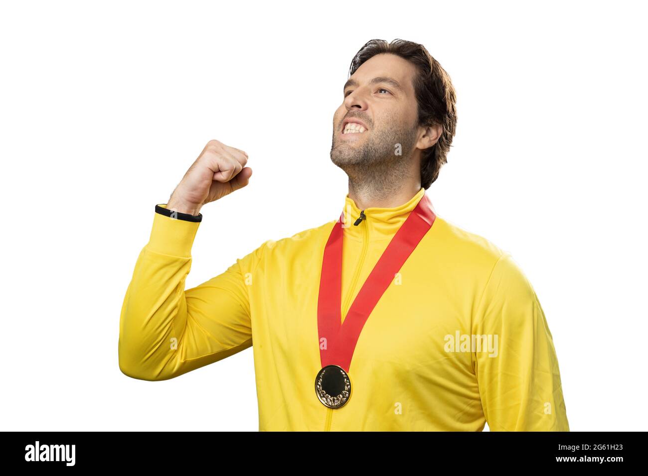 male athlete smiling after winning a gold medal in a white background ...