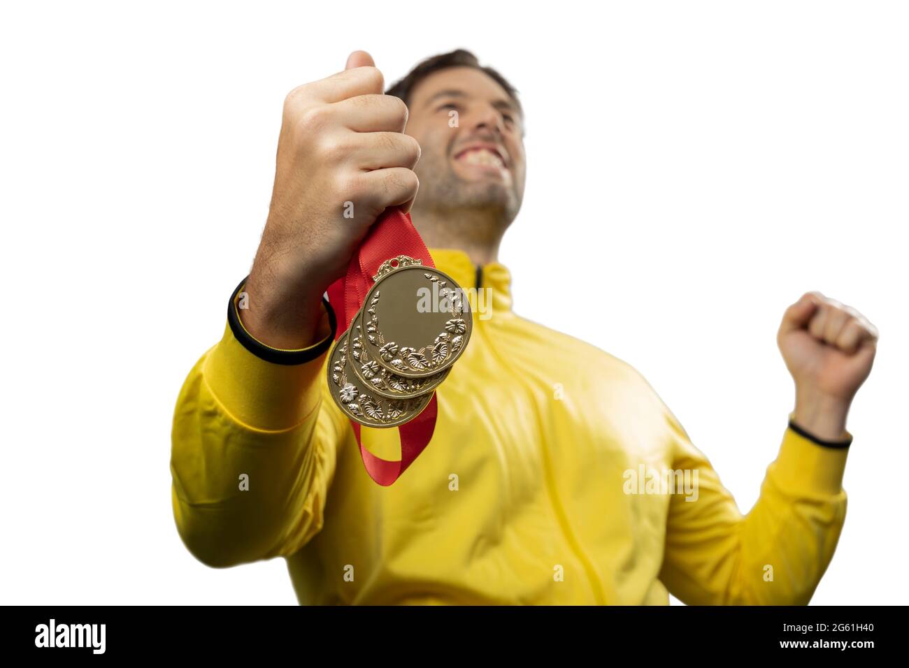 male athlete smiling after winning a gold medal in a white background ...