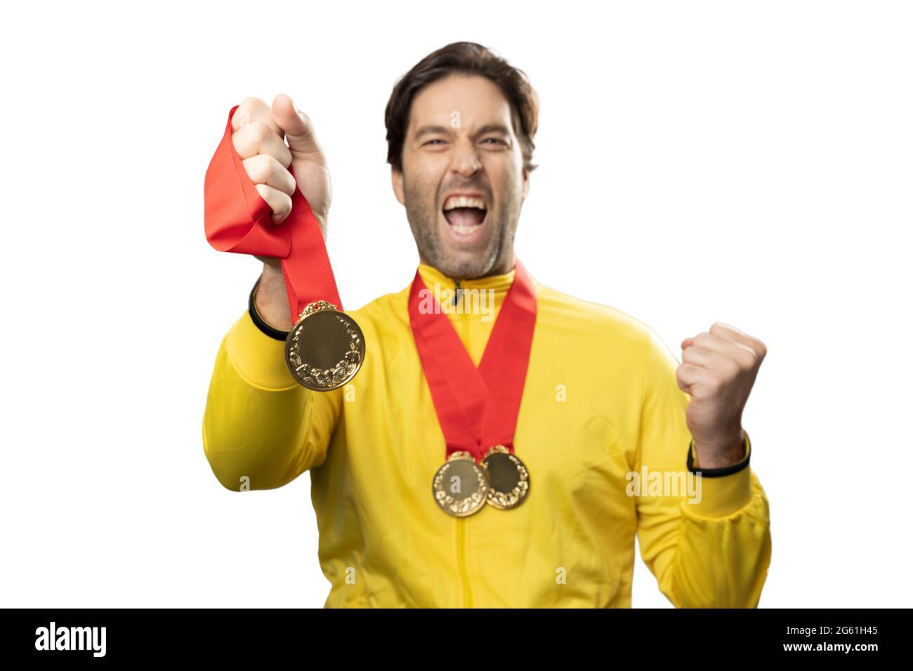 male athlete smiling after winning a gold medal in a white background ...