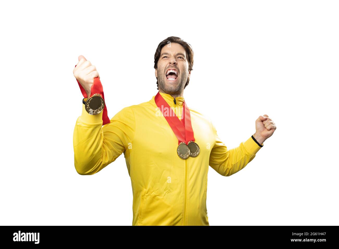 male athlete smiling after winning a gold medal in a white background ...